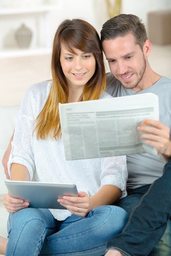 Couple Reading News from Different Source Stock Image - Image of ...