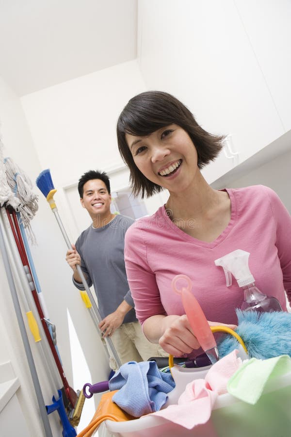 Couple Ready To Clean Home stock photo. Image of chores - 29651746