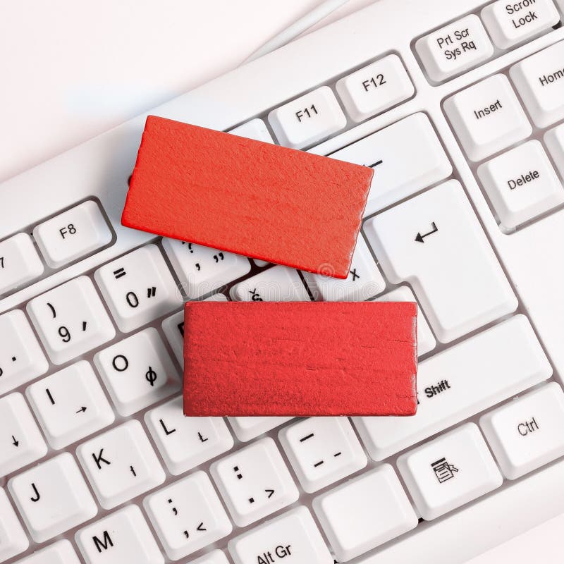 Couple of Red Erasers Placed on a White Keyboard on a White Background ...