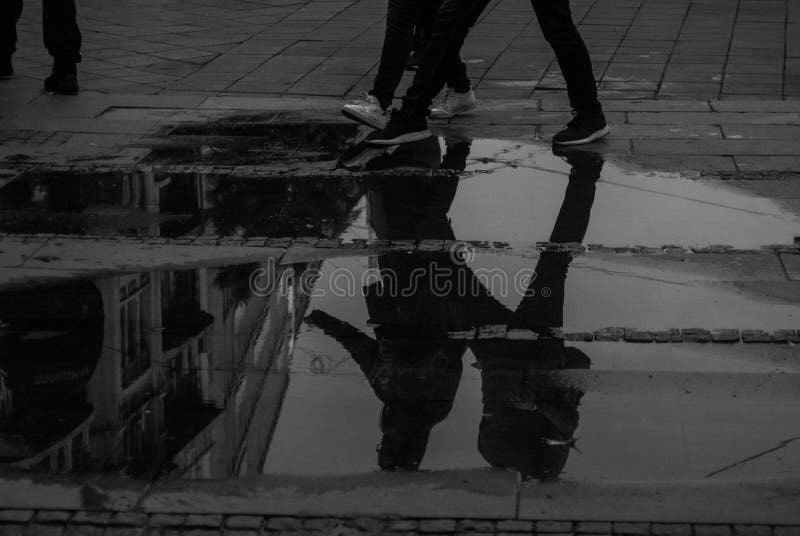 Couple Reflected on a Puddle Stock Image - Image of love, wife: 201031707