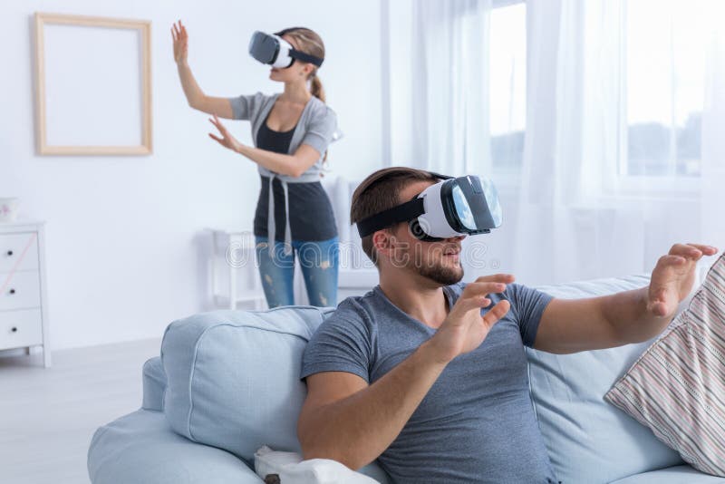 Couple Relaxing at Home Using VR Glasses Stock Photo - Image of reality ...