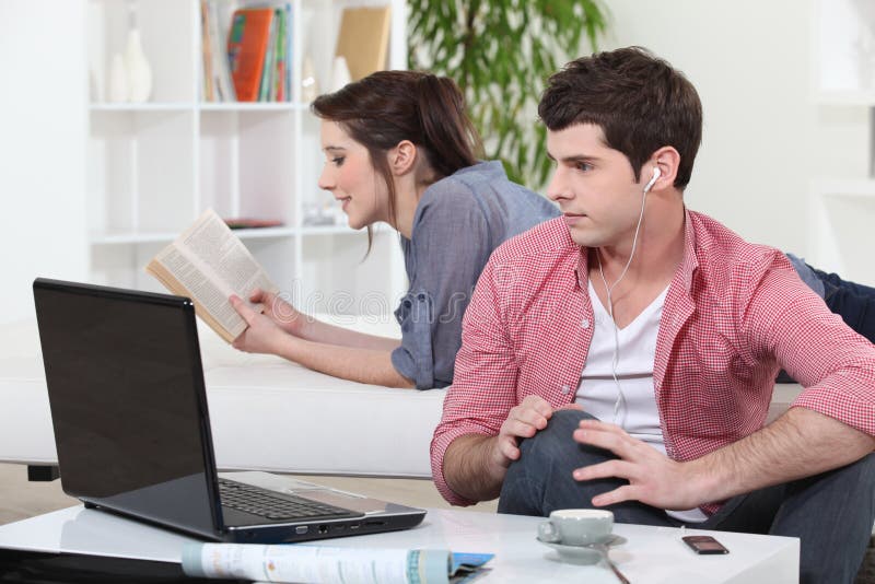 Couple relaxing at home stock image. Image of indoors - 32236637