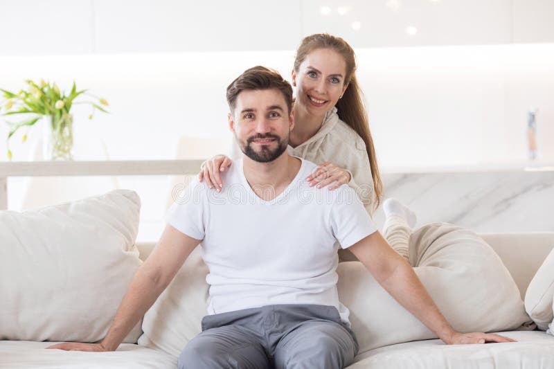 Couple Relaxing in Living Room Stock Photo - Image of beautiful, camera ...
