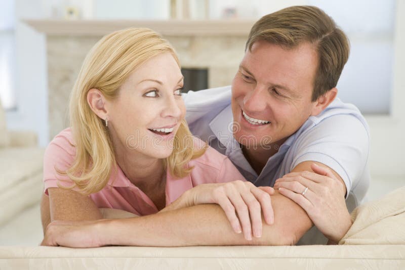 Couple Relaxing in Living Room and Smiling Stock Photo - Image of close ...