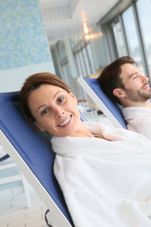 Couple Relaxing on Long Chairs in the Spa Stock Image - Image of ...