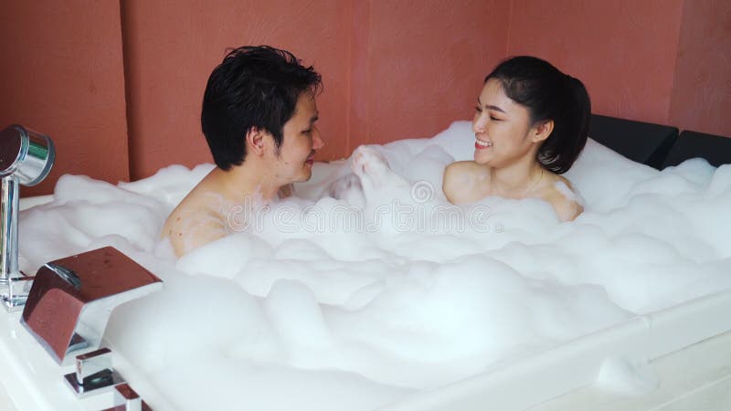 Couple Relaxing and Takes Bubble Bath in Bathtub with Foam Stock Video ...
