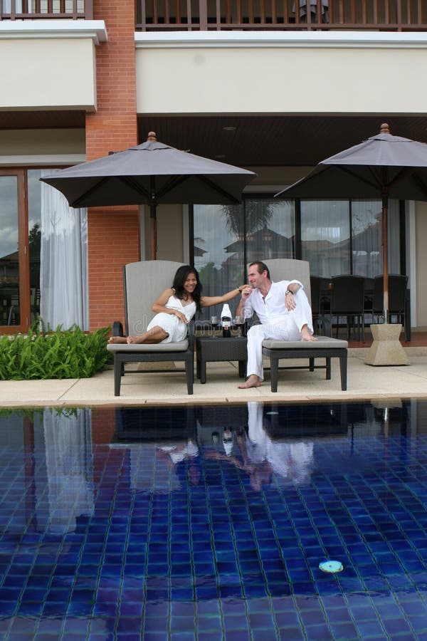 Couple at a resort stock photo. Image of building, pretty - 7912142