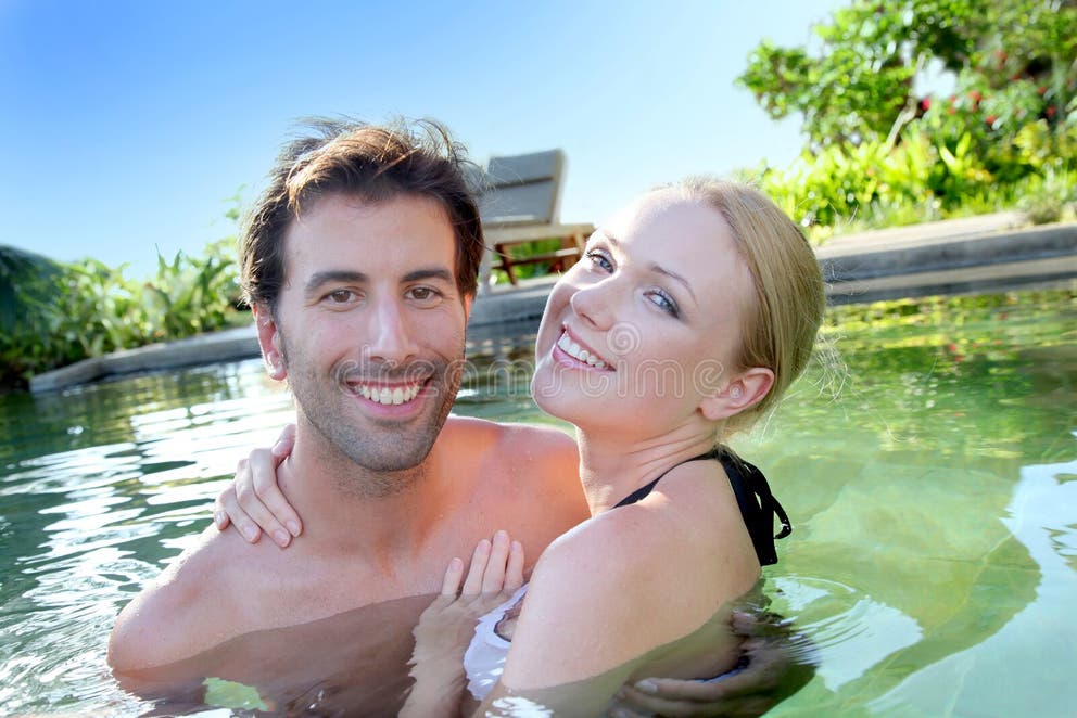 Couple in resort pool stock image. Image of honeymoon - 22149359