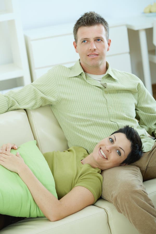 Couple resting at home stock image. Image of beautiful - 9414243