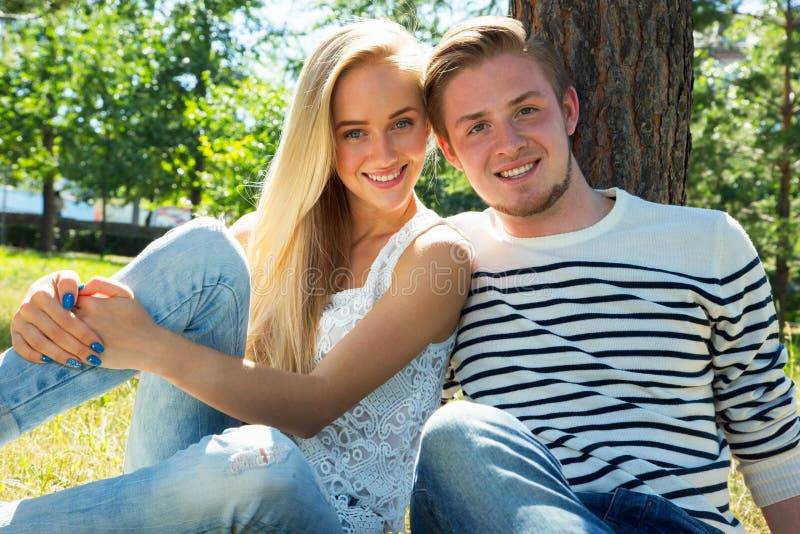 Couple Resting Under a Tree Stock Photo - Image of cheerful, portrait ...