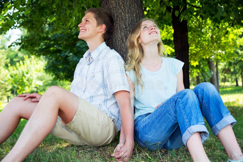 Couple Resting Under a Tree Stock Photo - Image of attractive, human ...
