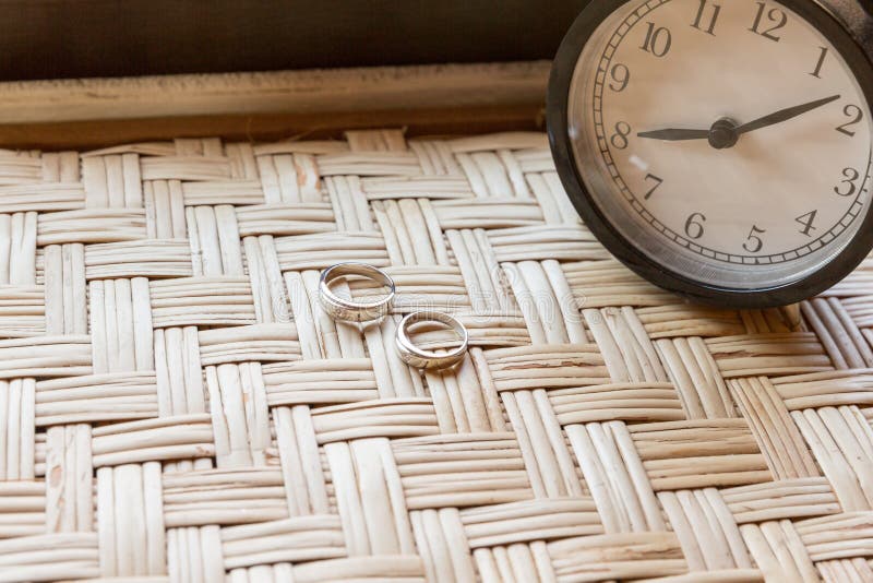Couple Ring on Weave Table with Clock Stock Image - Image of time, love ...