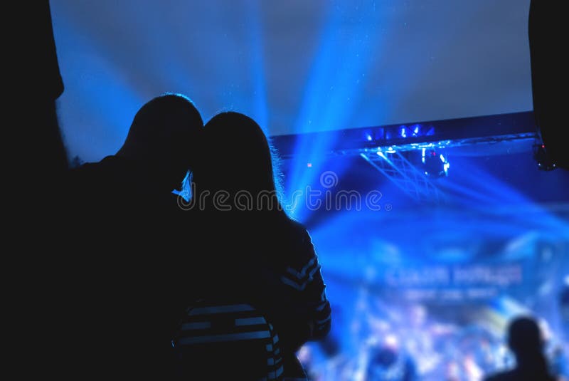 Couple at a rock concert editorial stock photo. Image of decoration ...