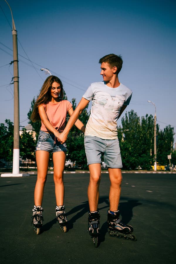 A Couple Roller-skating at Sunset. Black and White Photo Stock Photo ... A Couple Roller-skating at Sunset. Black and White Photo Stock Photo ...