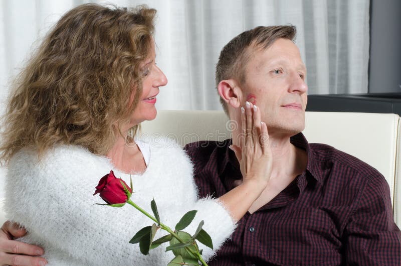 Couple with Rose Kissing on Couch Stock Image - Image of enjoy ...
