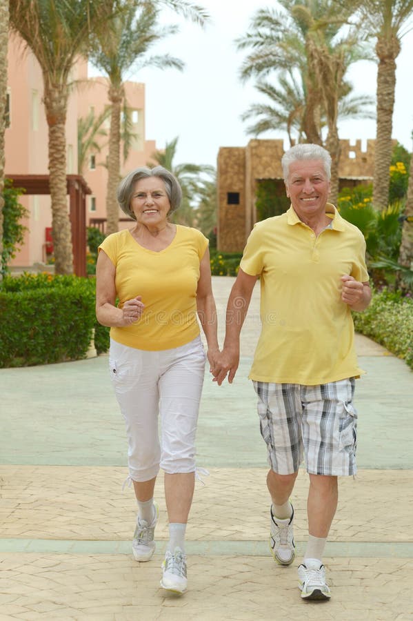 Couple Run at Tropic Hotel Resort Stock Photo - Image of look, male ...