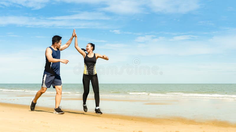 Couple Runners Jump and Touch Hands and Congratulate when Able To ...
