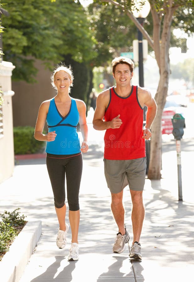 Couple Running Through Waves On Beach Holiday Stock Image - Image of ...