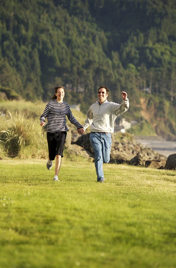 Couple Running, Holding Hands Stock Image - Image of outside, carefree ...