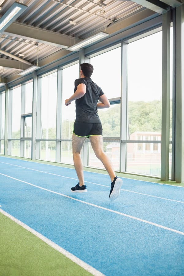 Couple Running on the Indoor Track Stock Photo - Image of club, female ...