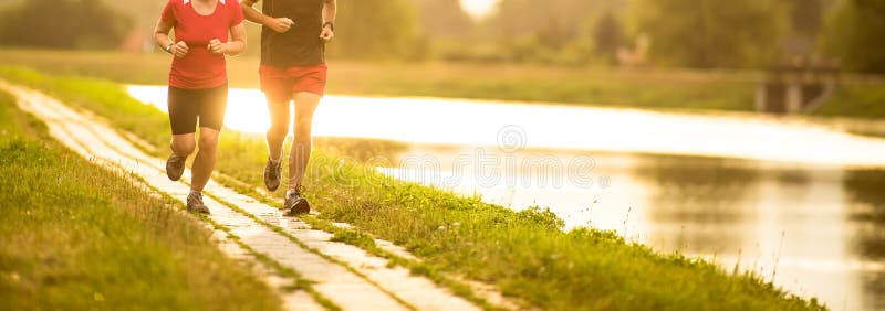 Couple Running Outdoors, at Sunset, by a River Stock Image - Image of ...