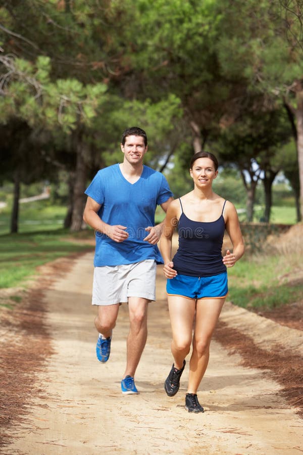 Couple running in park stock photo. Image of caucasian - 16824490