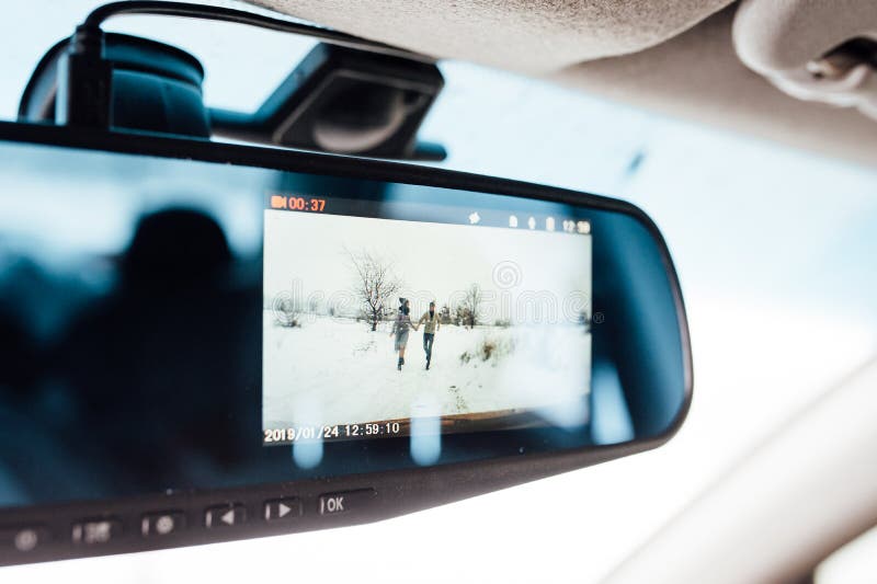 Couple Running in the Snow. View through the Screen of the DVR Stock ...