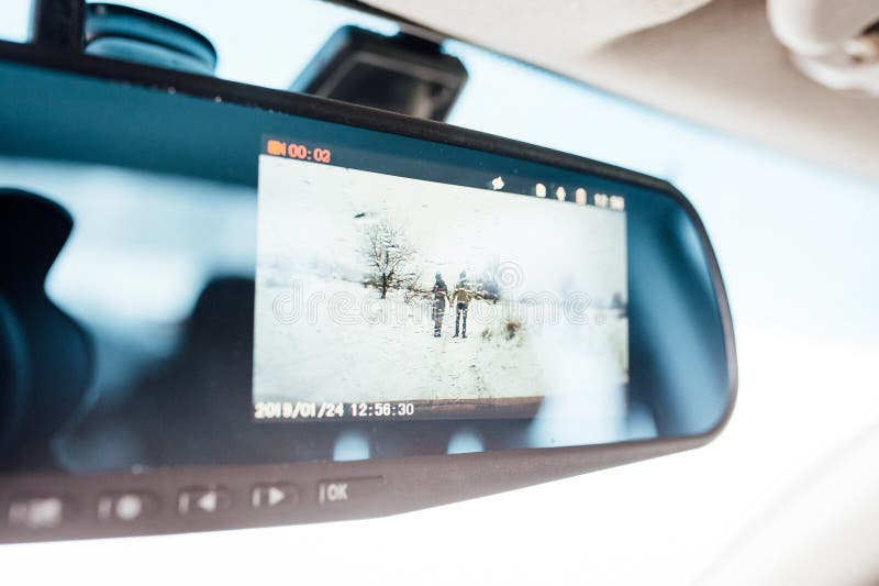 Couple Running in the Snow. View through the Screen of the DVR Stock ...