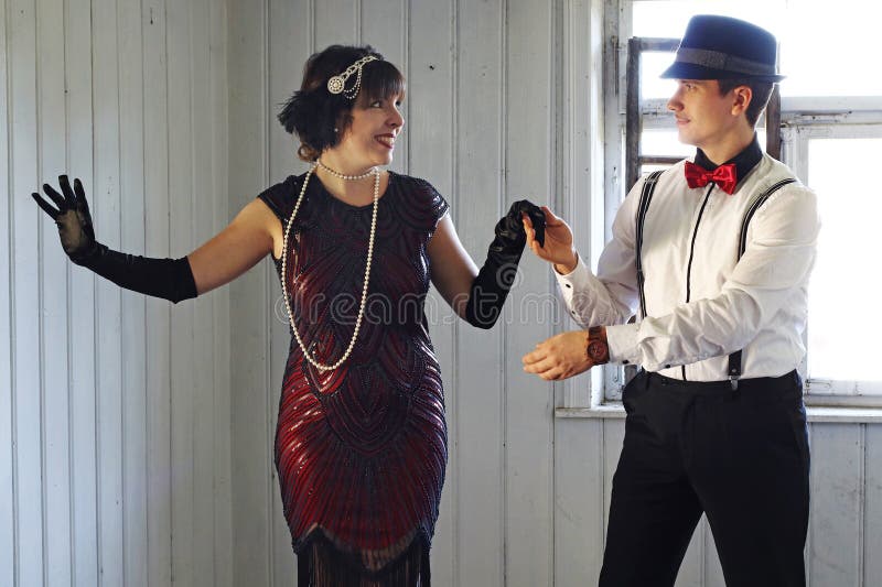 A Couple in 20s Retro Style Dancing in Front of a Window Stock Image ...