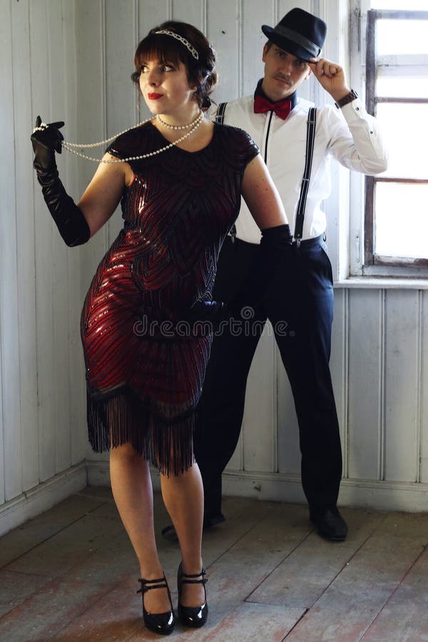 A Couple in 20s Retro Style Dancing in Front of a Window Stock Photo ...