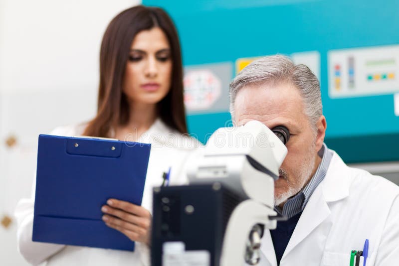 Couple of Scientist Researching in a Laboratory Stock Photo - Image of ...