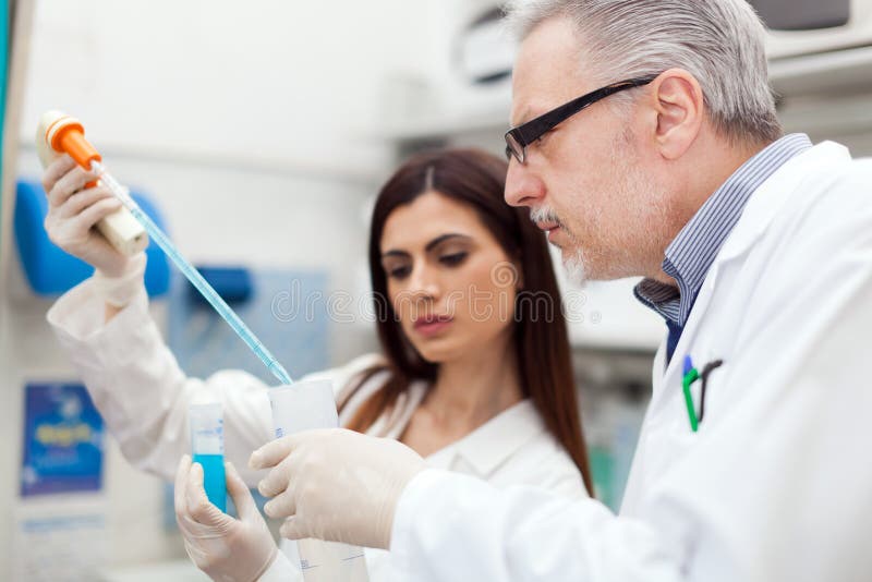 Couple of Scientists in a Laboratory Stock Image - Image of focus, blue ...
