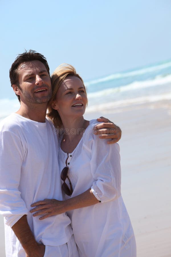 Couple by the sea stock image. Image of blond, smiling - 22779139