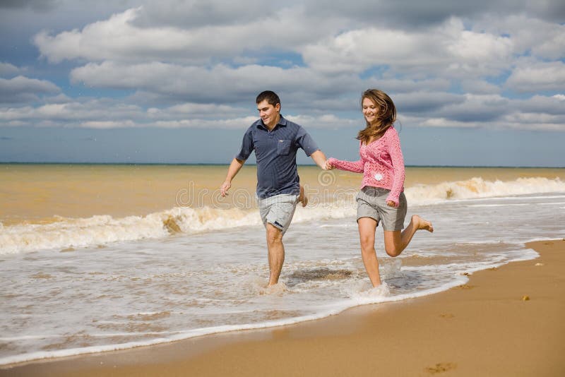 Attractive Couple at the Sea Stock Photo - Image of love, amour: 23025360