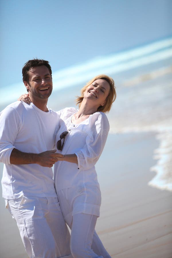 Couple by the sea stock photo. Image of clothes, couple - 23792532