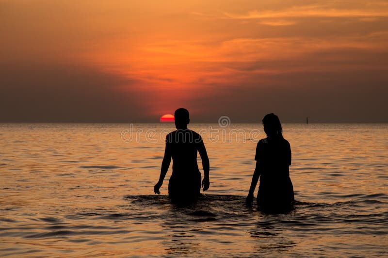 Couple in the sea stock photo. Image of skyline, seaside - 67303214