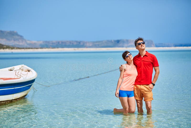 Couple in the sea stock photo. Image of outdoors, nature - 71792358