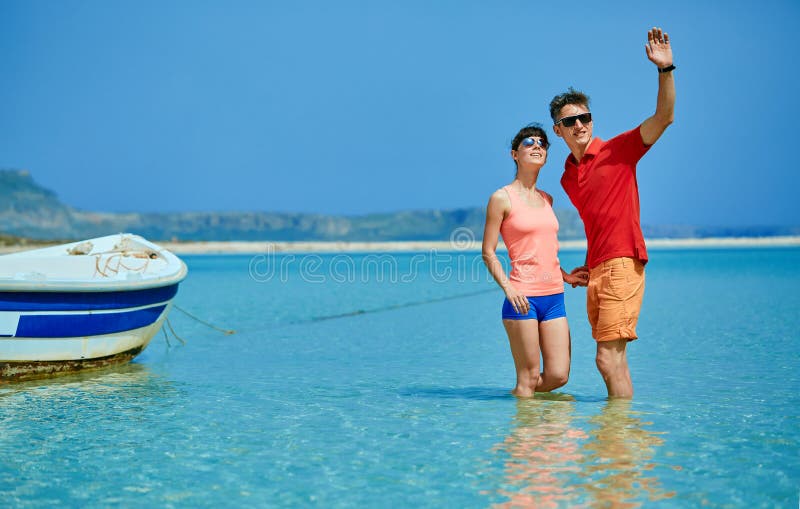 Couple in the sea stock image. Image of freedom, activity - 75845263