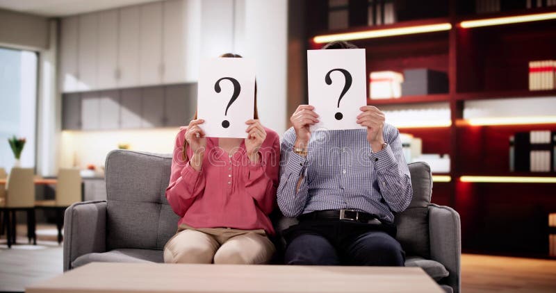 Couple Seeking Answers with Question Mark Held Stock Photo - Image of ...