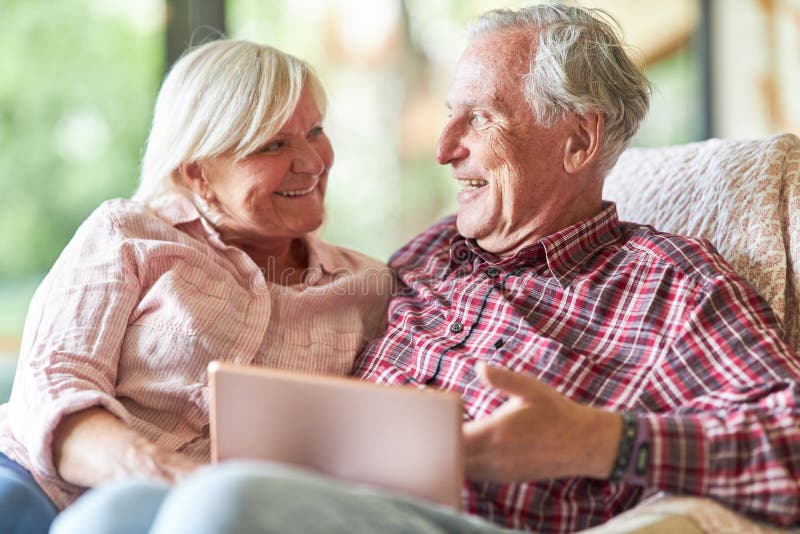 Couple of Seniors is Having Fun with the Tablet Computer Stock Image ...