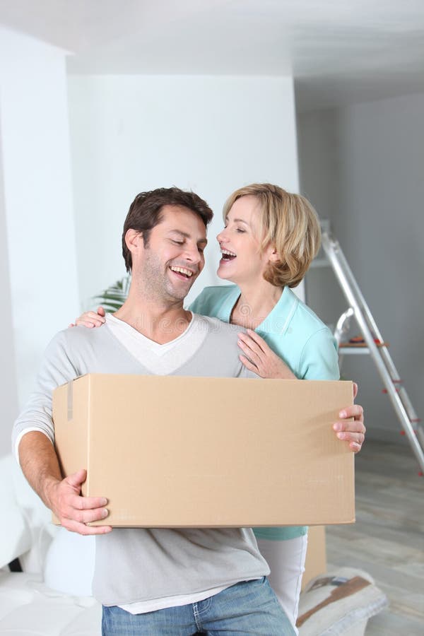 Couple setting up home stock photo. Image of ceilings - 30469966