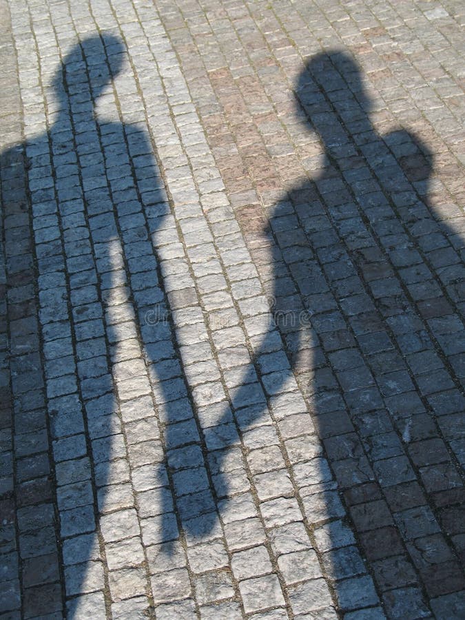 Couple shadow stock photo. Image of grey, woman, paving - 1231856