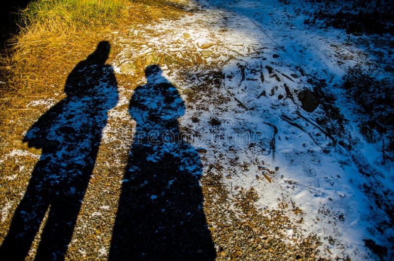 Couple shadow on the beach stock image. Image of shadow - 138877167