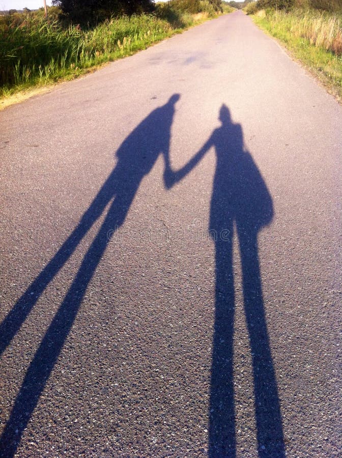Couple shadows stock photo. Image of hands, sunset, shadow - 117792868