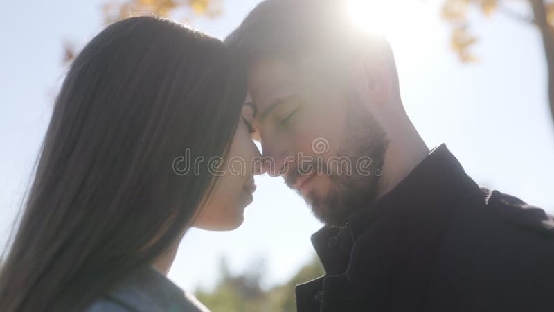 Romantic Couple Sharing a Quiet Moment in an Autumn Park Setting Stock ...