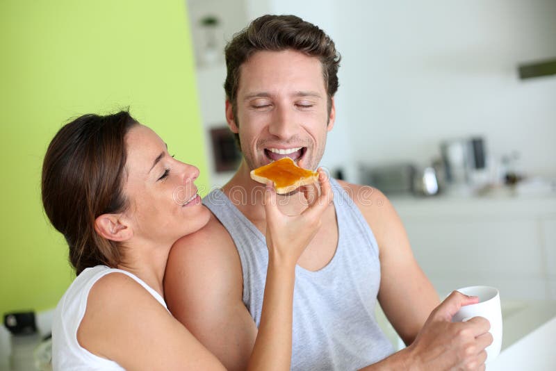 Couple sharing breakfast stock image. Image of vacation - 30598223