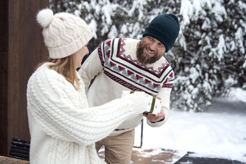 Couple Sharing the Christmas Present Outdoors Stock Image - Image of ...