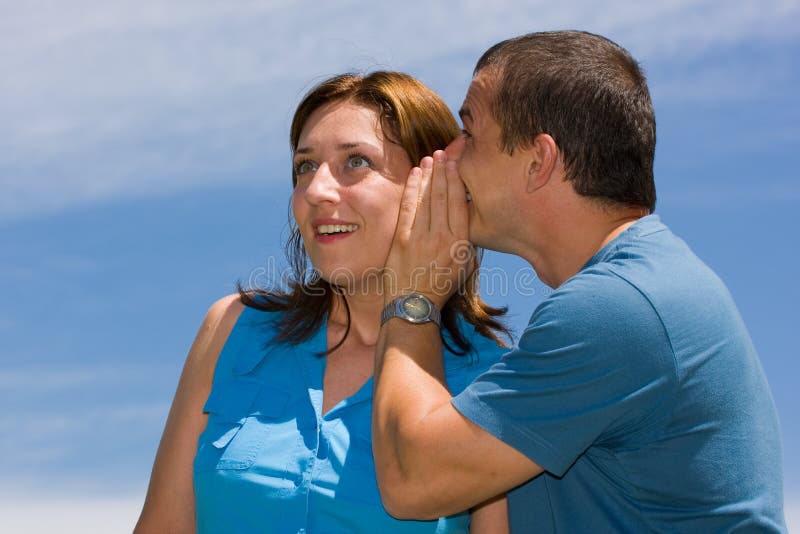 Couple sharing secrets stock image. Image of couple, lips - 5689291