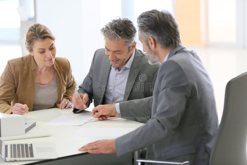Couple Signing a Construction Contract Stock Photo - Image of building ...