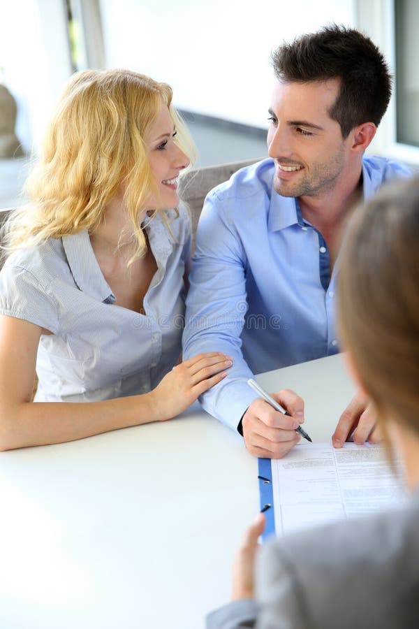 Couple signing contract stock photo. Image of adults - 28270802